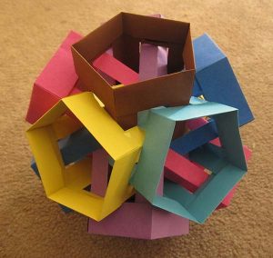 Origami: Six intersecting pentagonal prisms